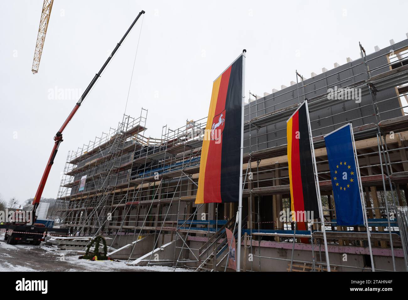Friedland, Germany. 01st Dec, 2023. View of the scaffolded new building ...