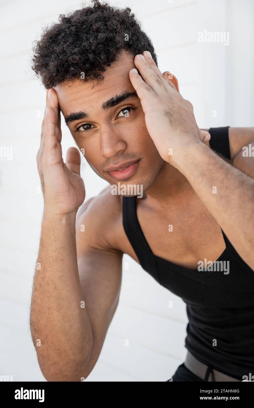 portrait of handsome young cuban man looking at camera in Miami, south ...
