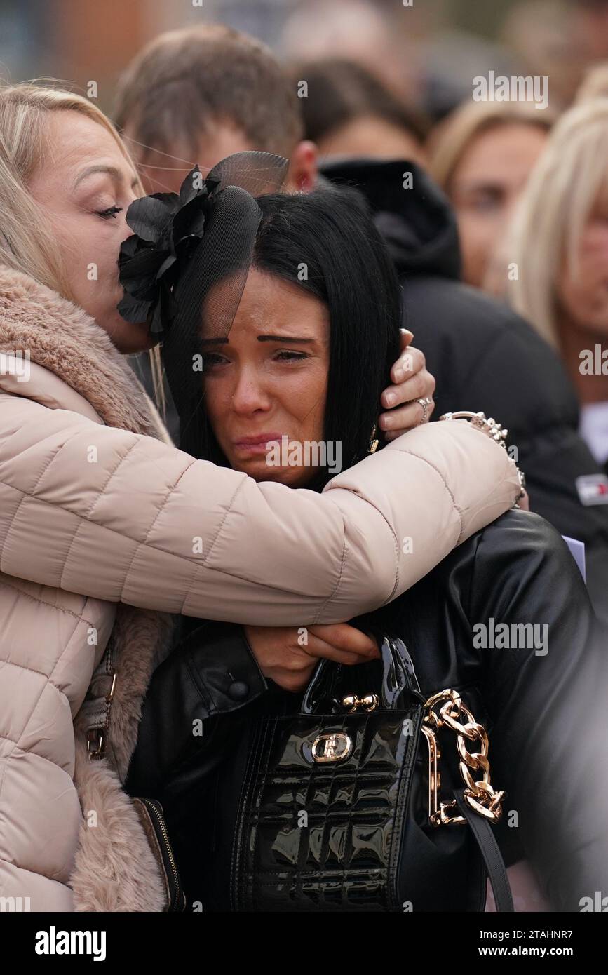 The mother of Indi Gregory, Claire Staniforth (centre) is comforted ...
