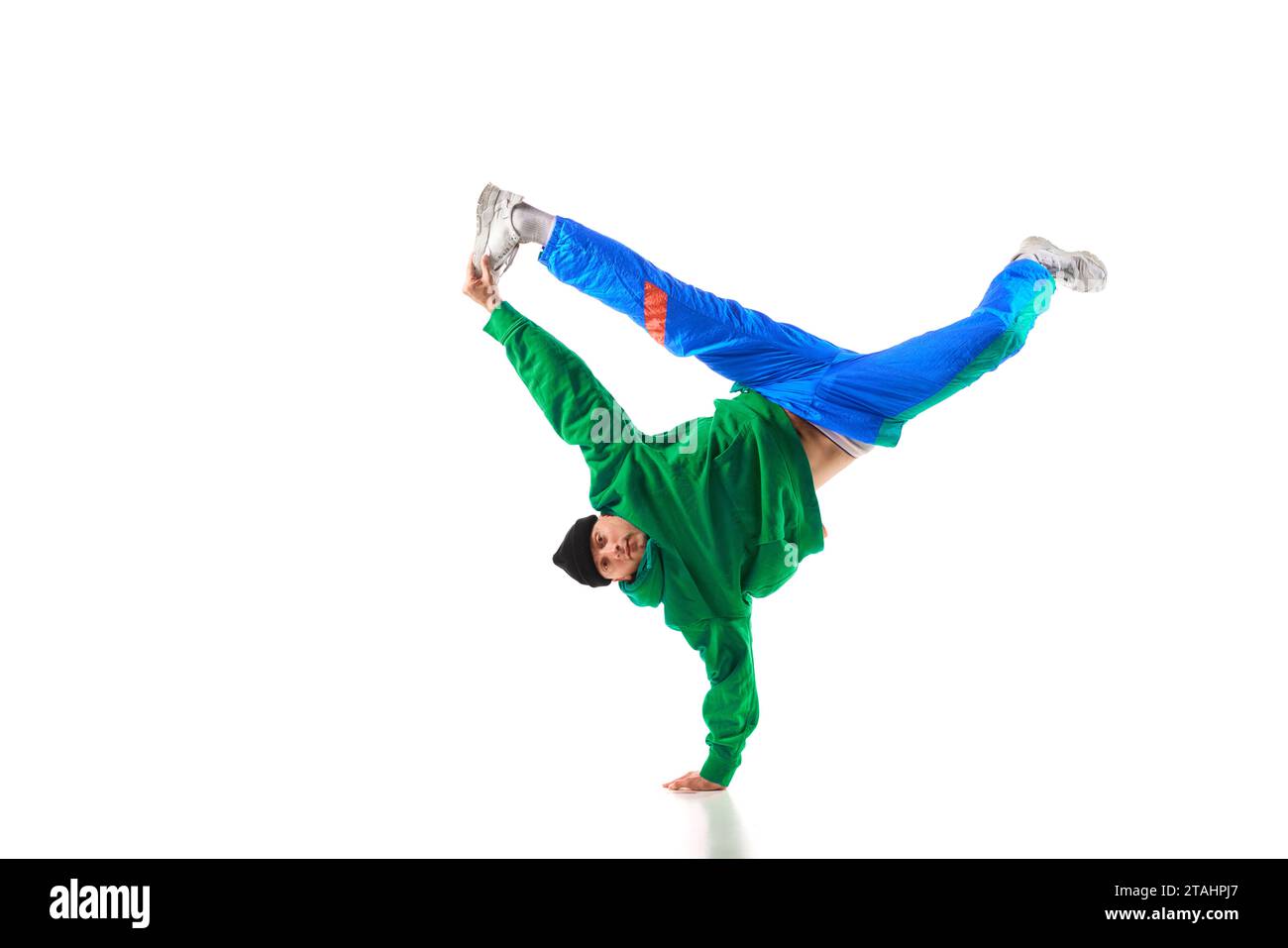 Young sportive man performing dance, hip-hop, breakdance elements in ...