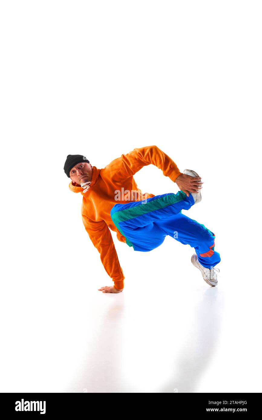 Stylishly dressed man, guy, professional dancer training breakdance ...