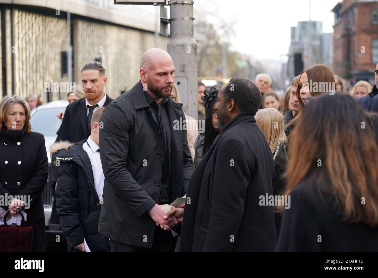The father of Indi Gregory, Dean Gregory (centre) speaks with mourners ...