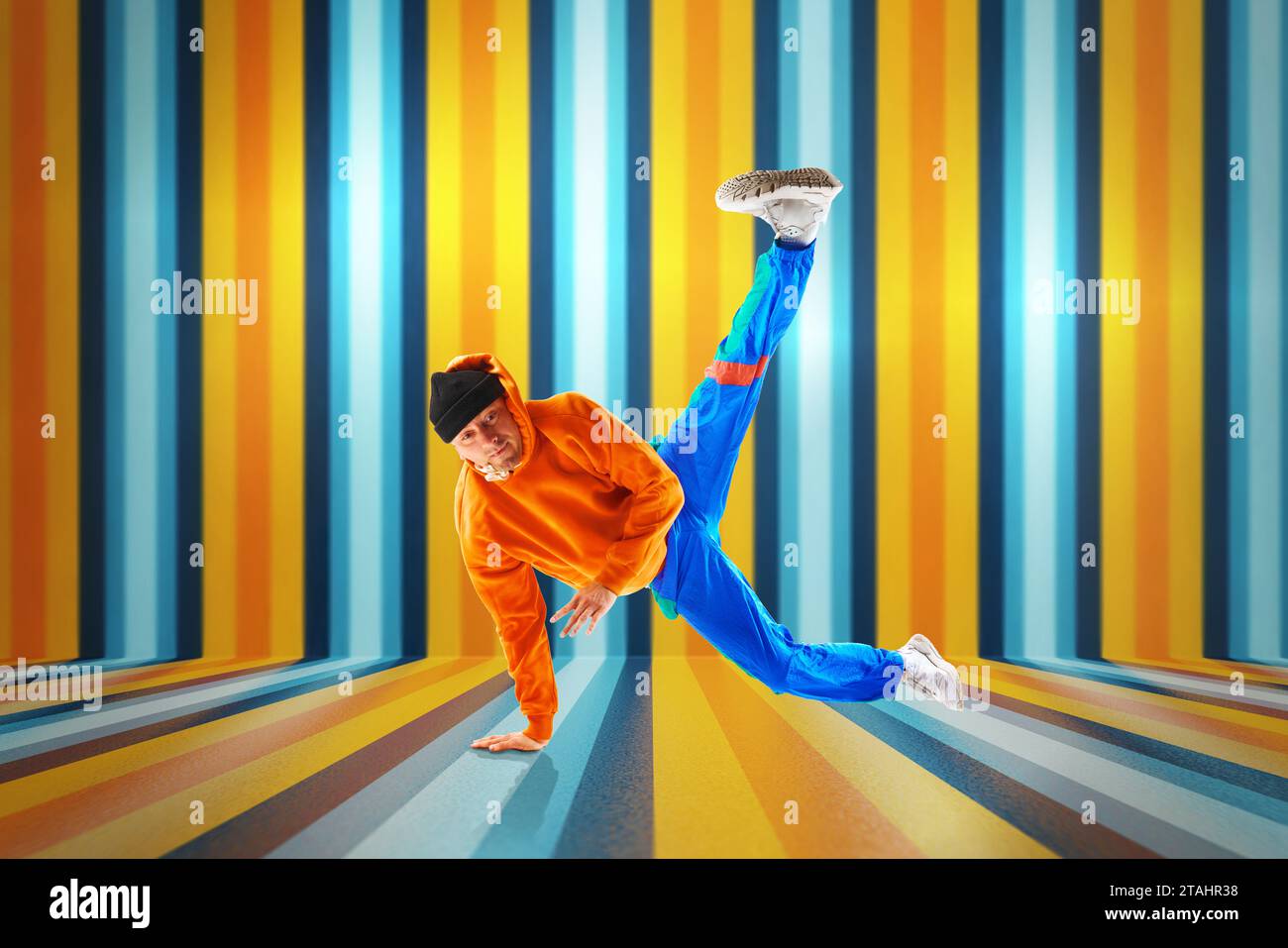 Stylishly dressed man, guy, professional dancer training breakdance ...