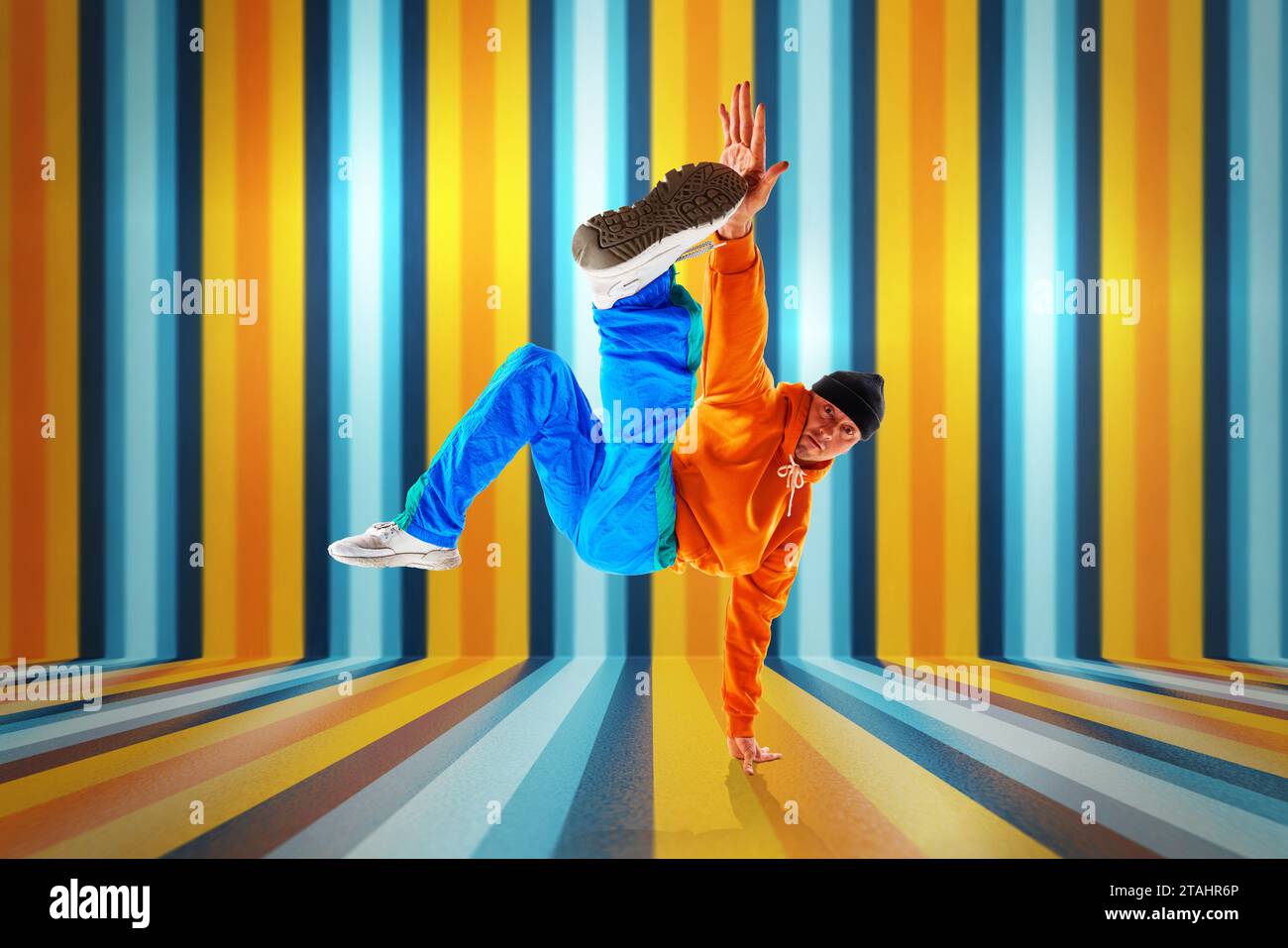 Young sportive man performing dance, hip-hop, breakdance elements in ...