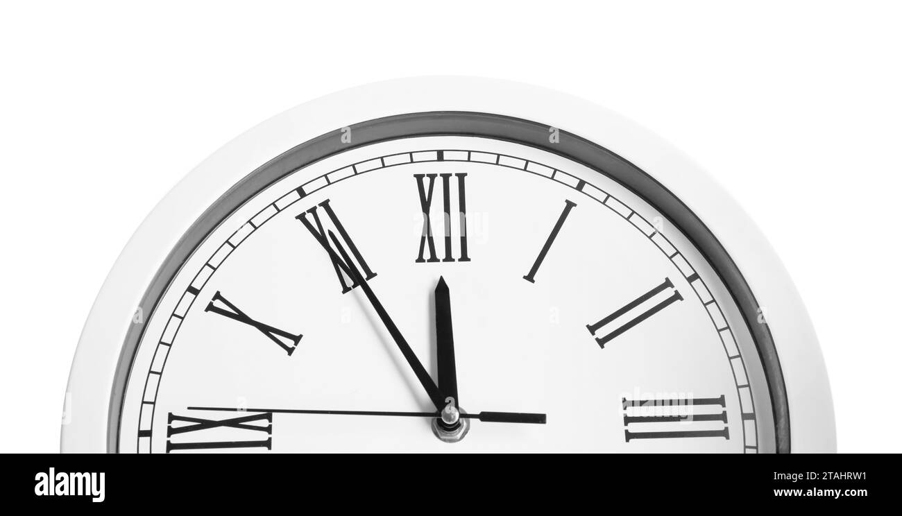 Clock showing five minutes until midnight on white background, closeup ...