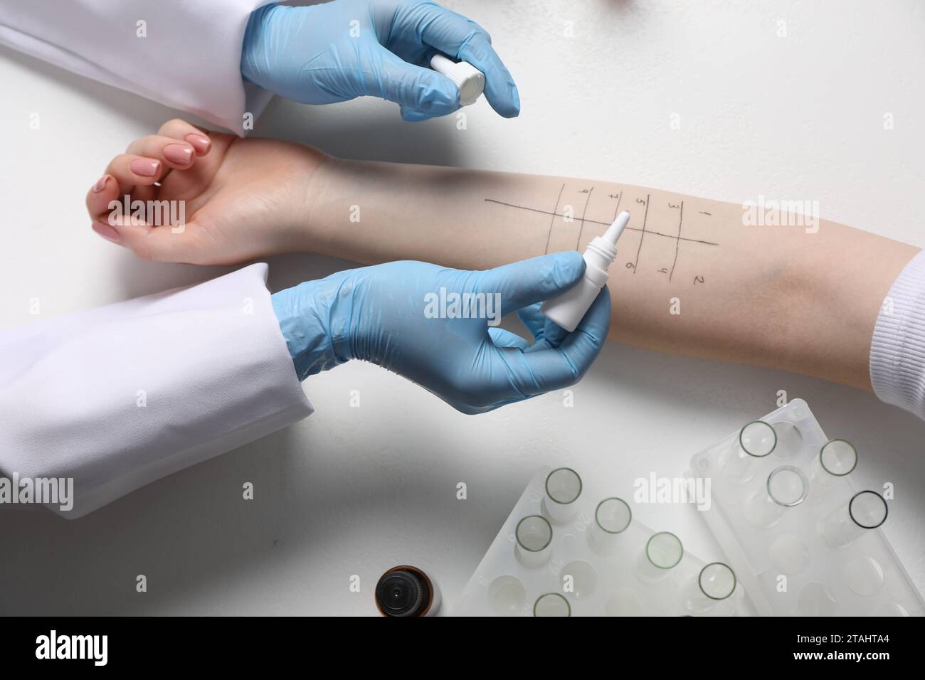 Doctor doing skin allergy test at light table, top view Stock Photo - Alamy