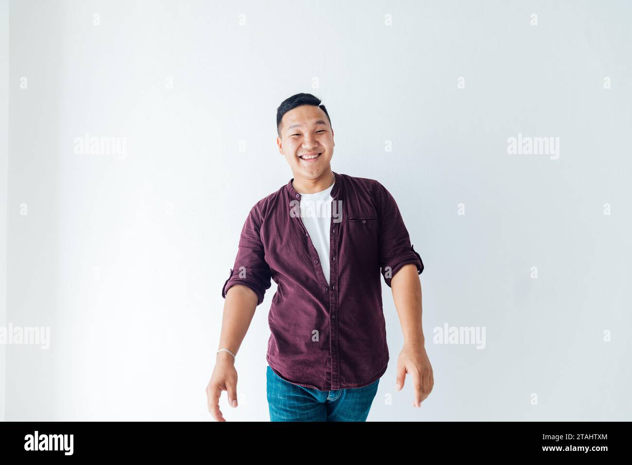 Man posing on white background in studio Stock Photo - Alamy