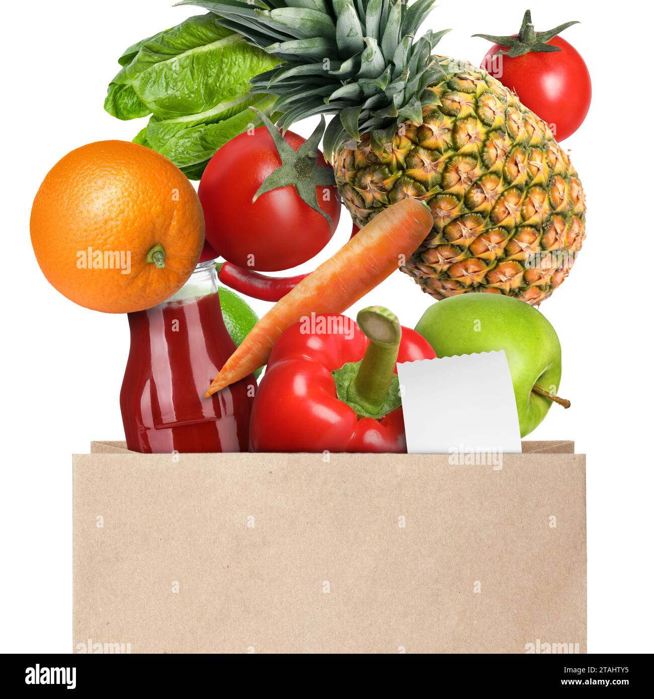 Different food products falling into paper bag on white background ...