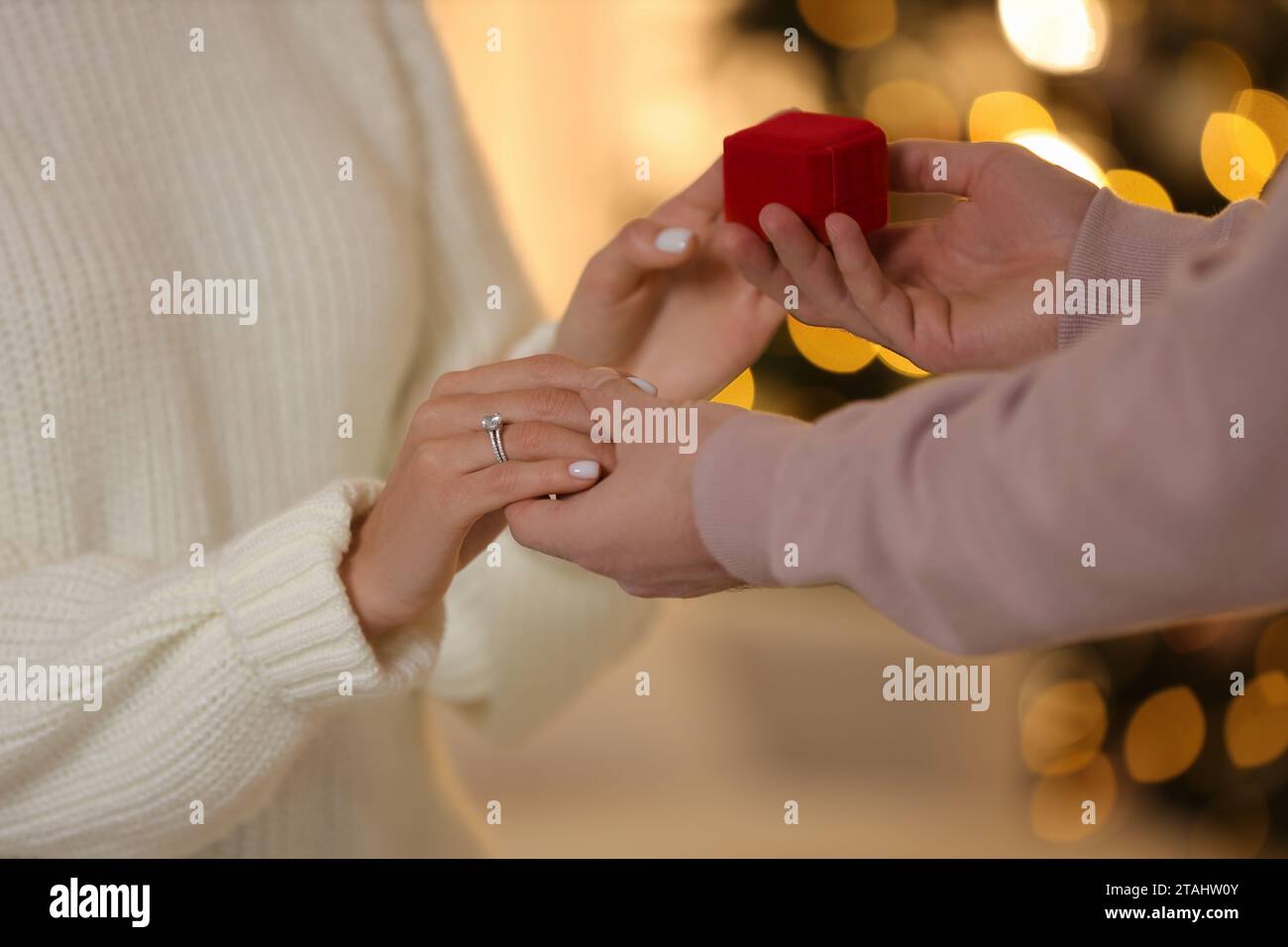 Making proposal. Woman with engagement ring and her fiance holding ...