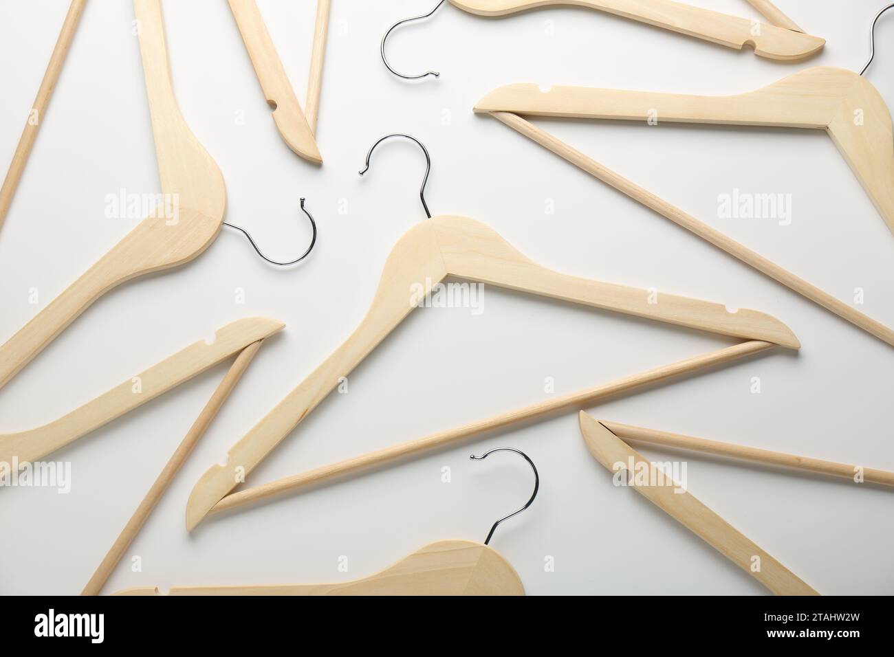 Wooden hangers on white background, flat lay Stock Photo - Alamy