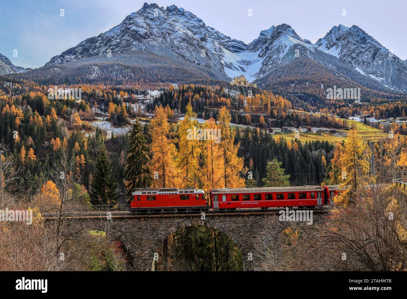 Ftan, Switzerland - November 06. 2022: The Rhaetian Railway red train ...