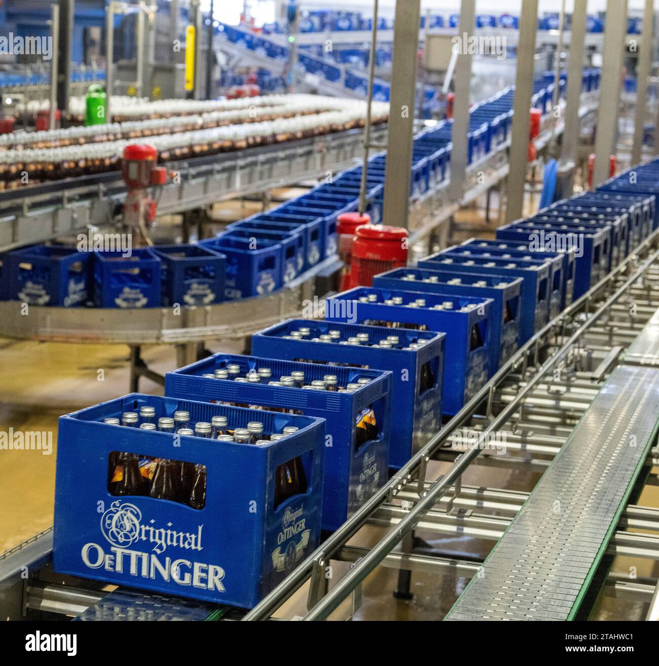 Oettingen, Germany. 01st Dec, 2023. A cola mix drink is filled into ...