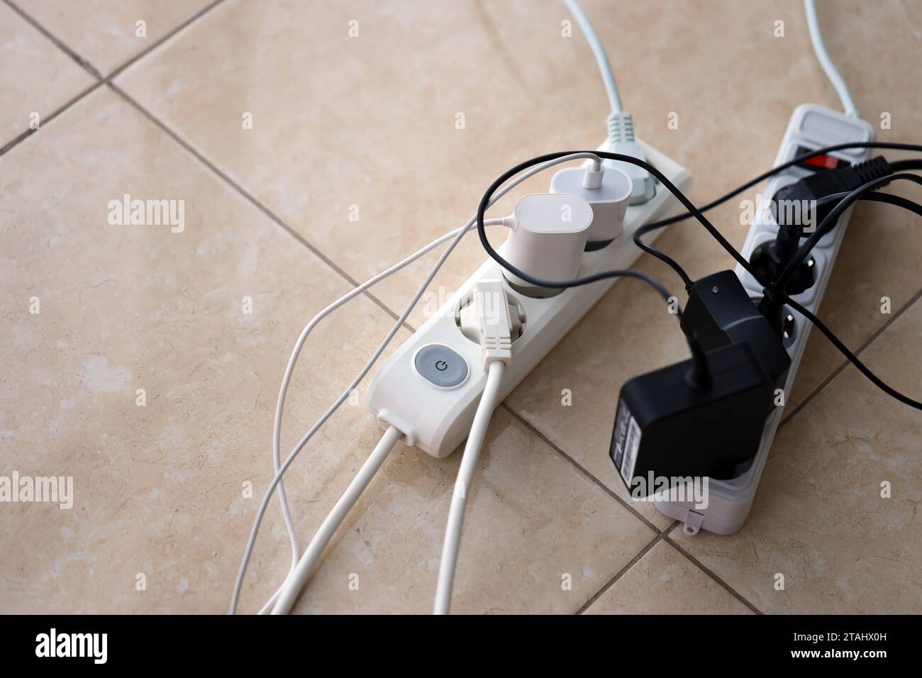 Overloaded power boards. Power strips with different electrical plugs ...