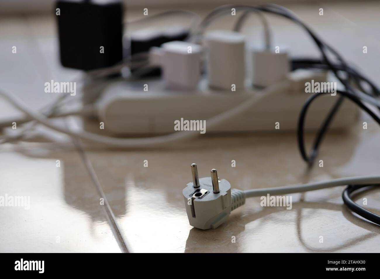 Overloaded power boards. Power strips with different electrical plugs ...