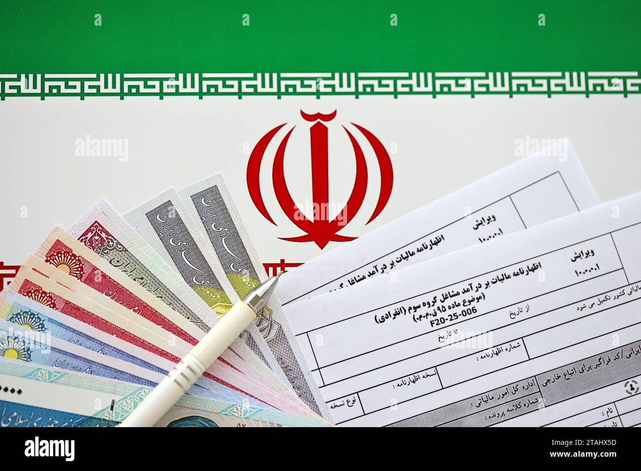 Iranian annual income tax return form F20-25-006 ready to fill on table ...