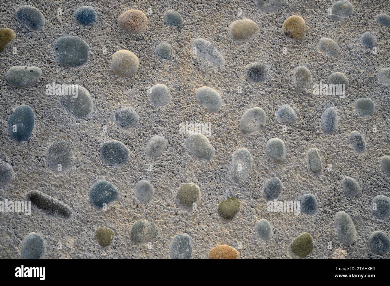 sea pebbles with concrete as background 3 Stock Photo - Alamy