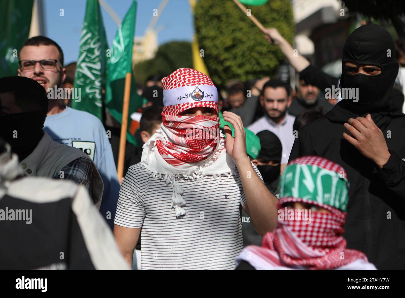 Hebron, West Bank. December 1, 2023. Palestinians raise flags of the ...