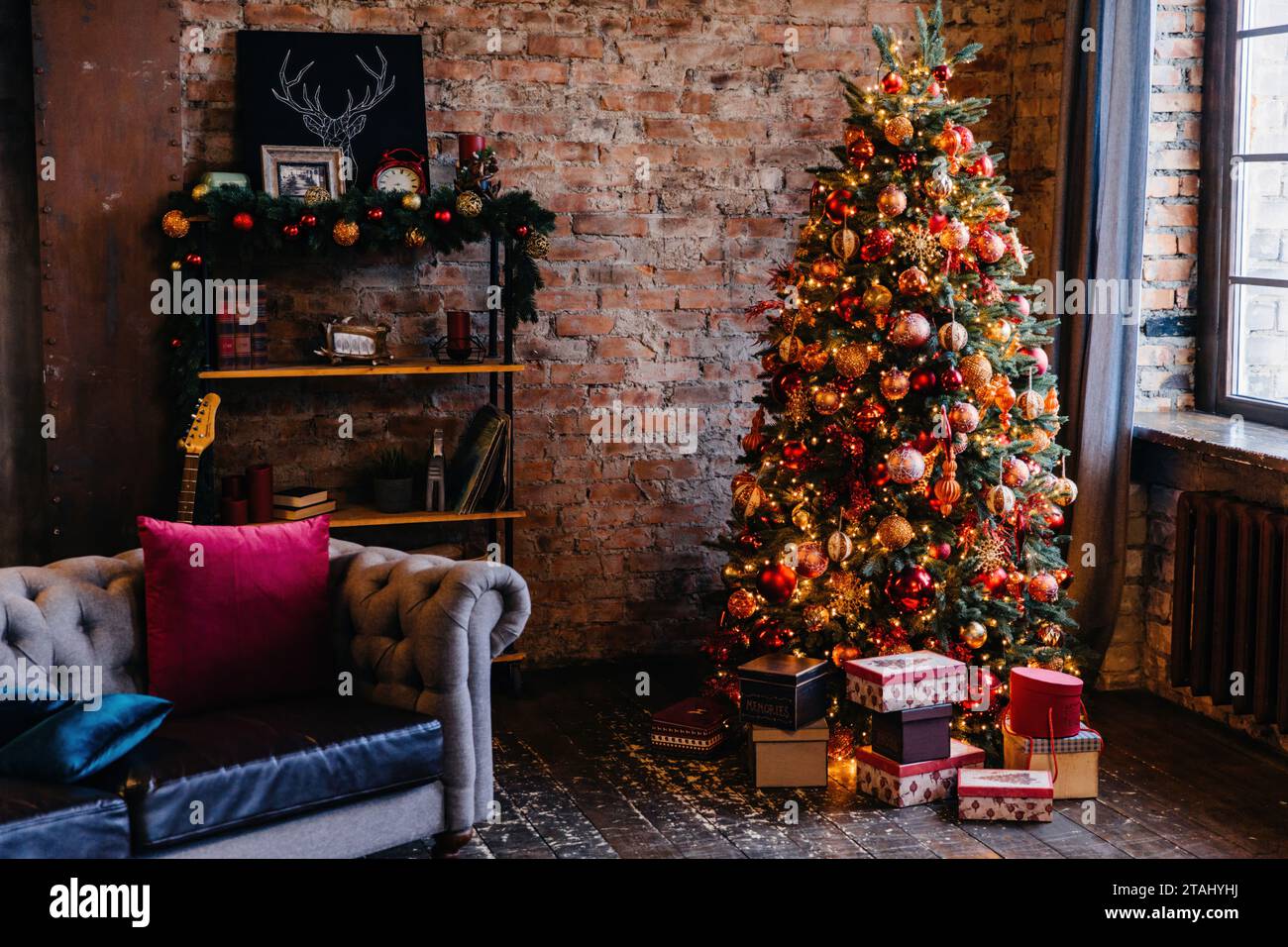 Cozy Christmas setting with a decorated tree, gifts, and a brick wall ...