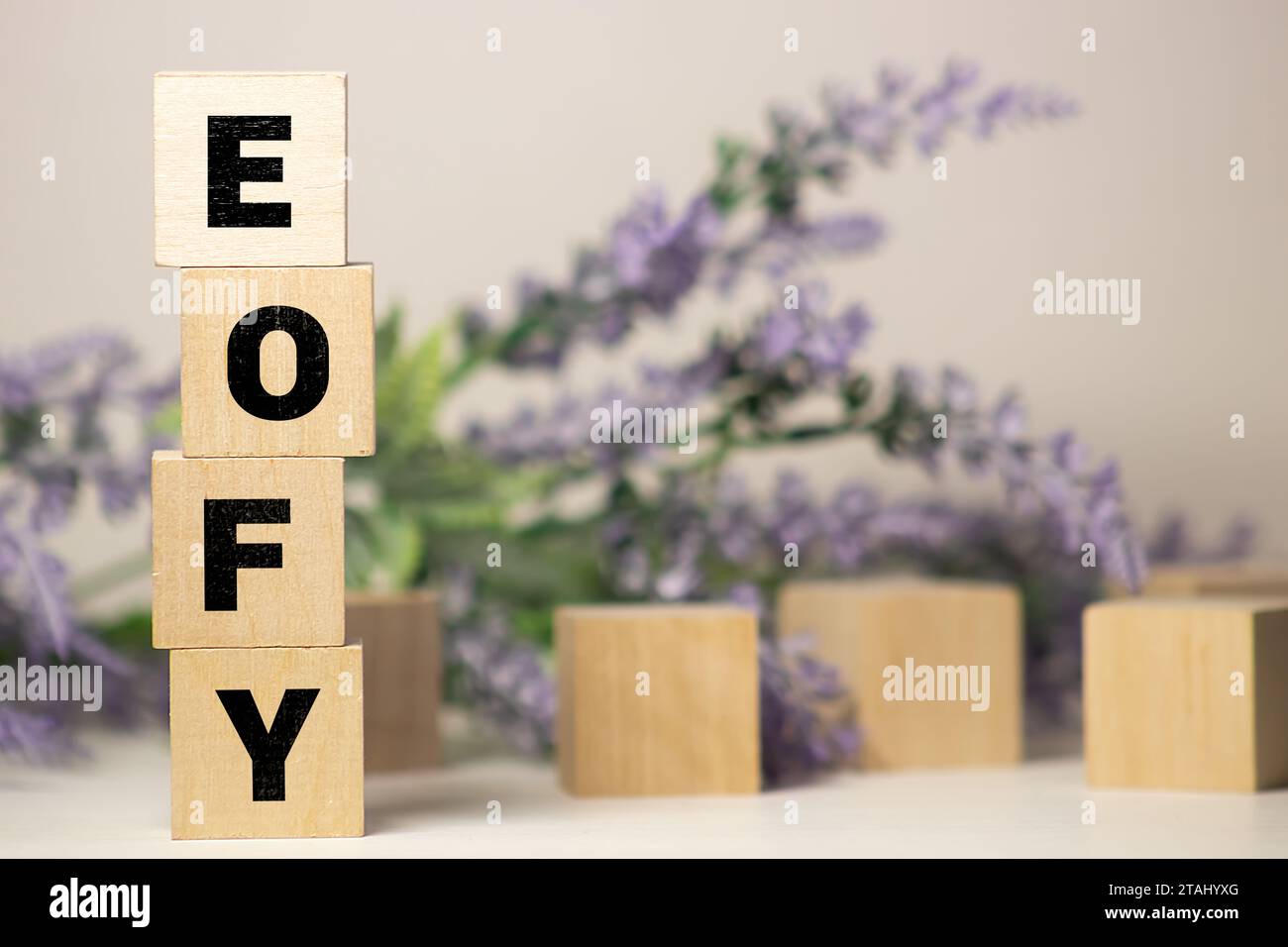 EOFY, End of Financial Year text. wood cubes and white background Stock ...