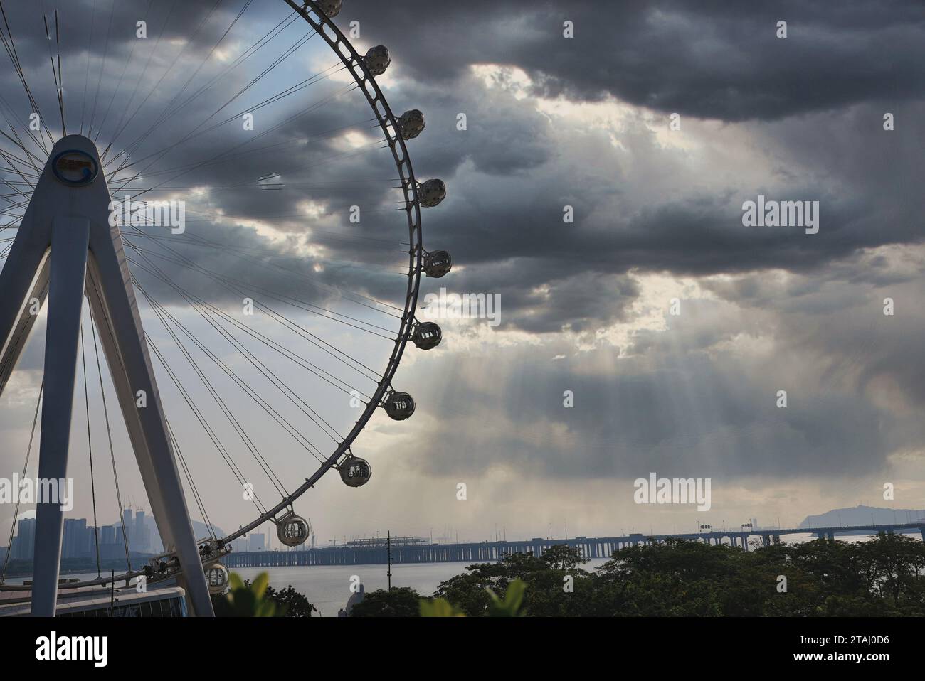A dark and ominous sky looming overhead, casting a shadow over a Ferris ...