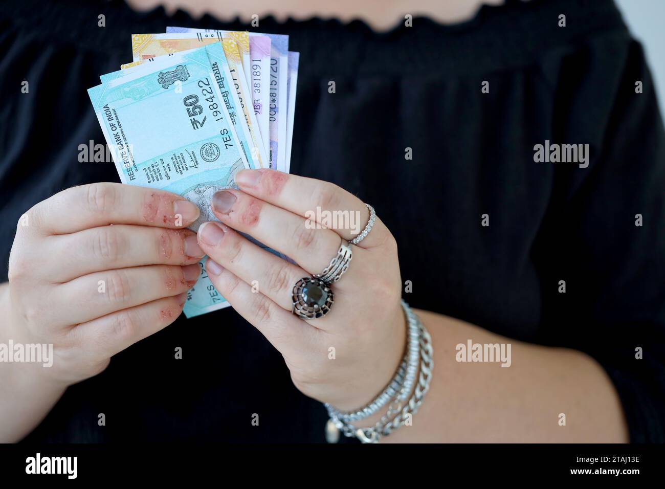 Woman hand with indian rupees bills close up. Concept of financial ...