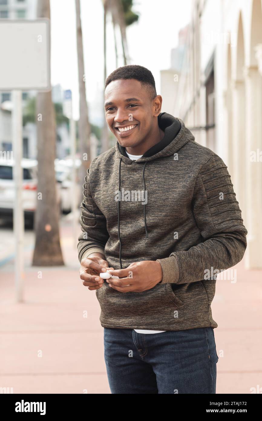 Smiling man holding case hi-res stock photography and images - Alamy