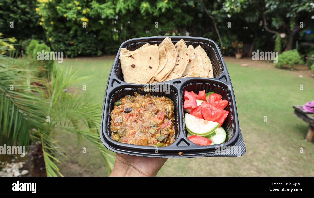 Roti sabji with salad combo food parcel lunch Stock Photo - Alamy