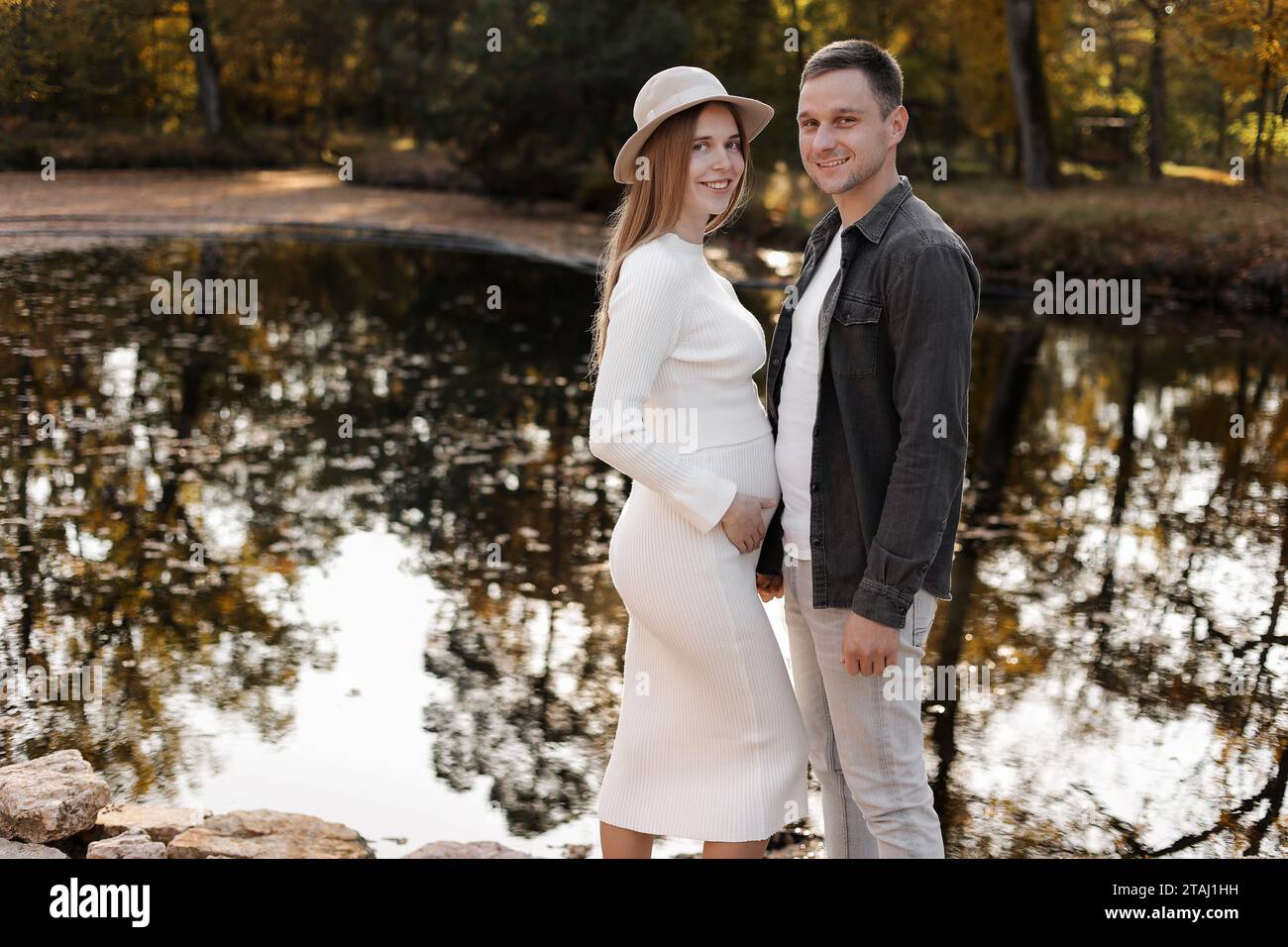 Family day. Stylish marriage pregnant couple waiting for baby. Man is ...