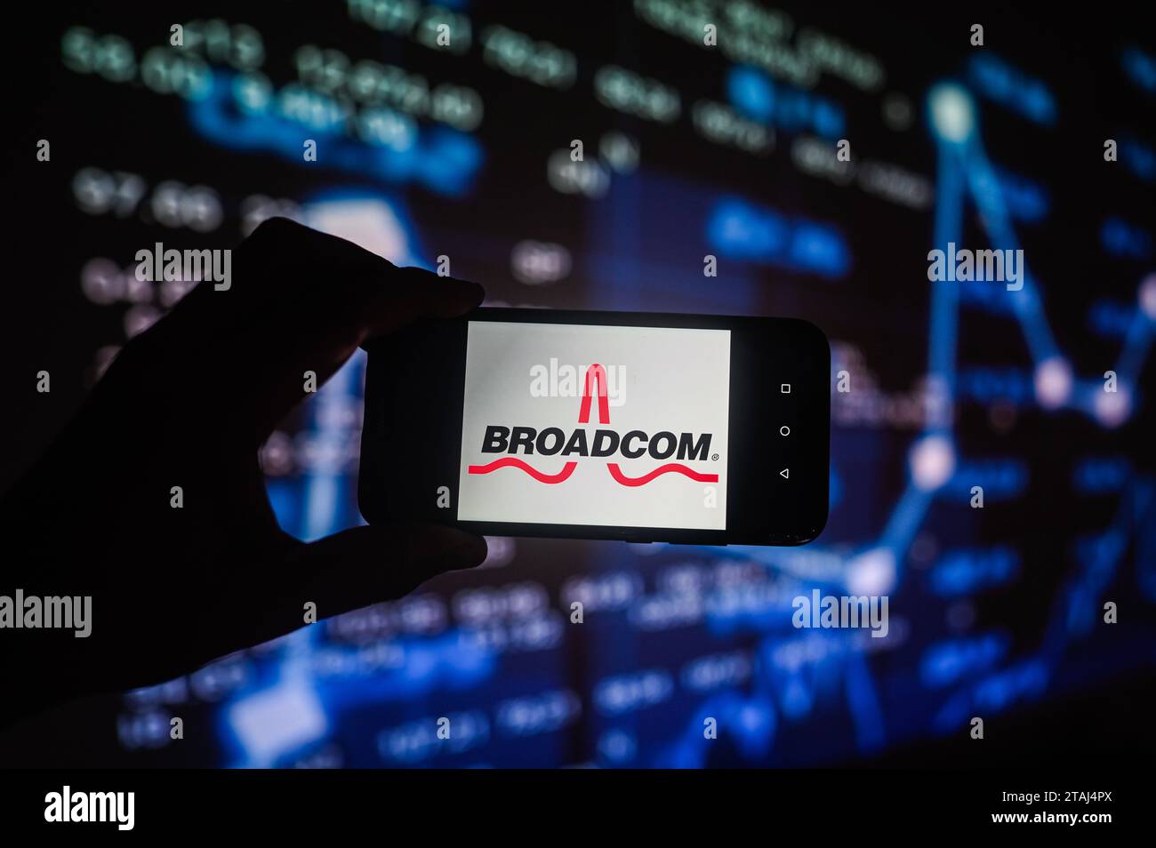 In this photo illustration, a Broadcom logo is displayed on a ...