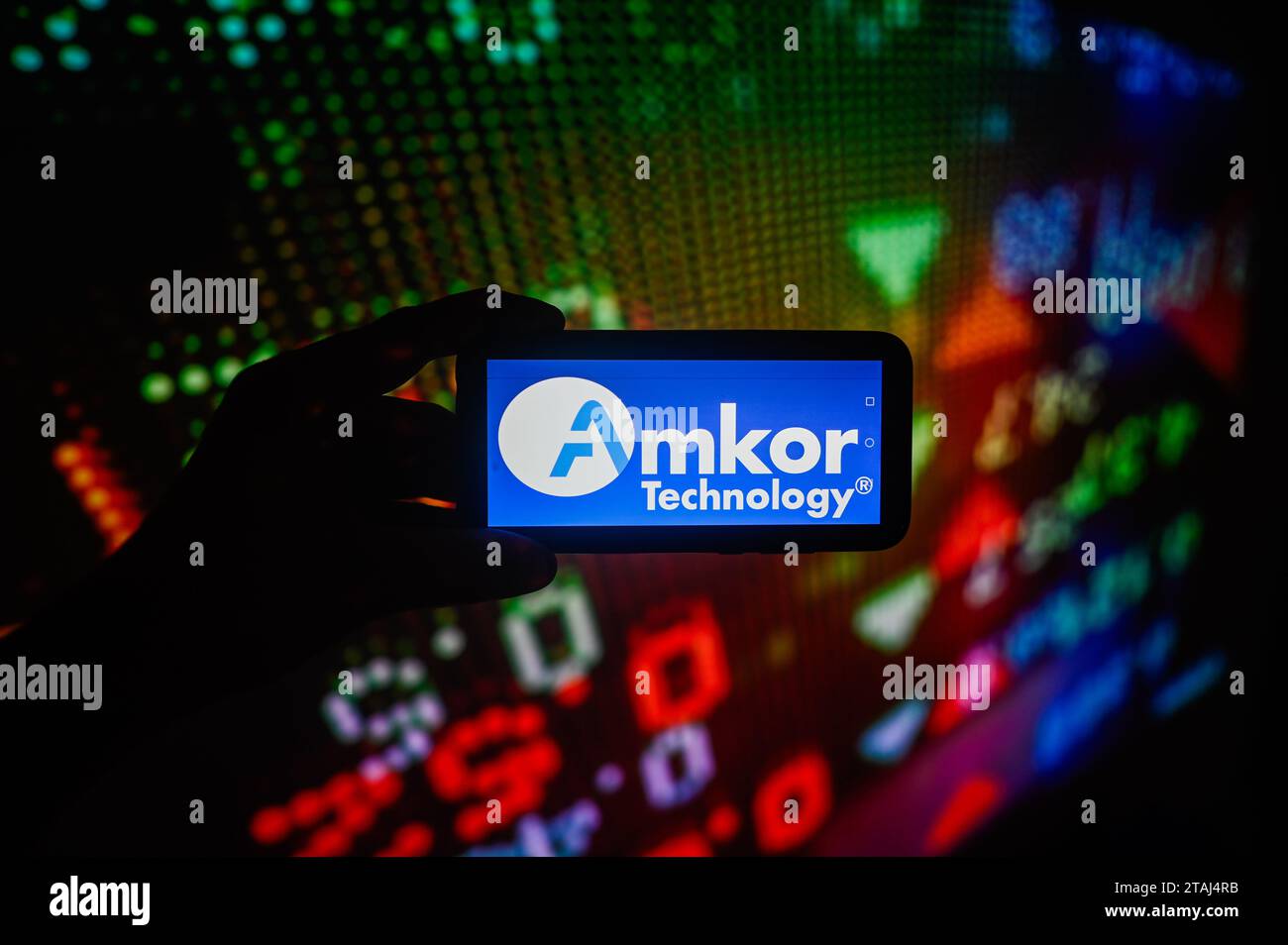 In this photo illustration, an Amkor Technology logo is displayed on a ...