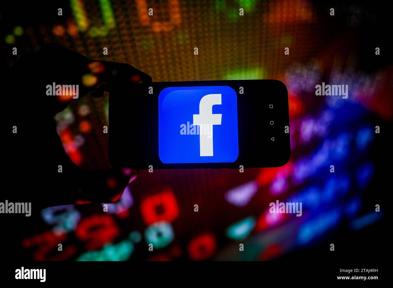 In this photo illustration, a Facebook logo is displayed on a ...