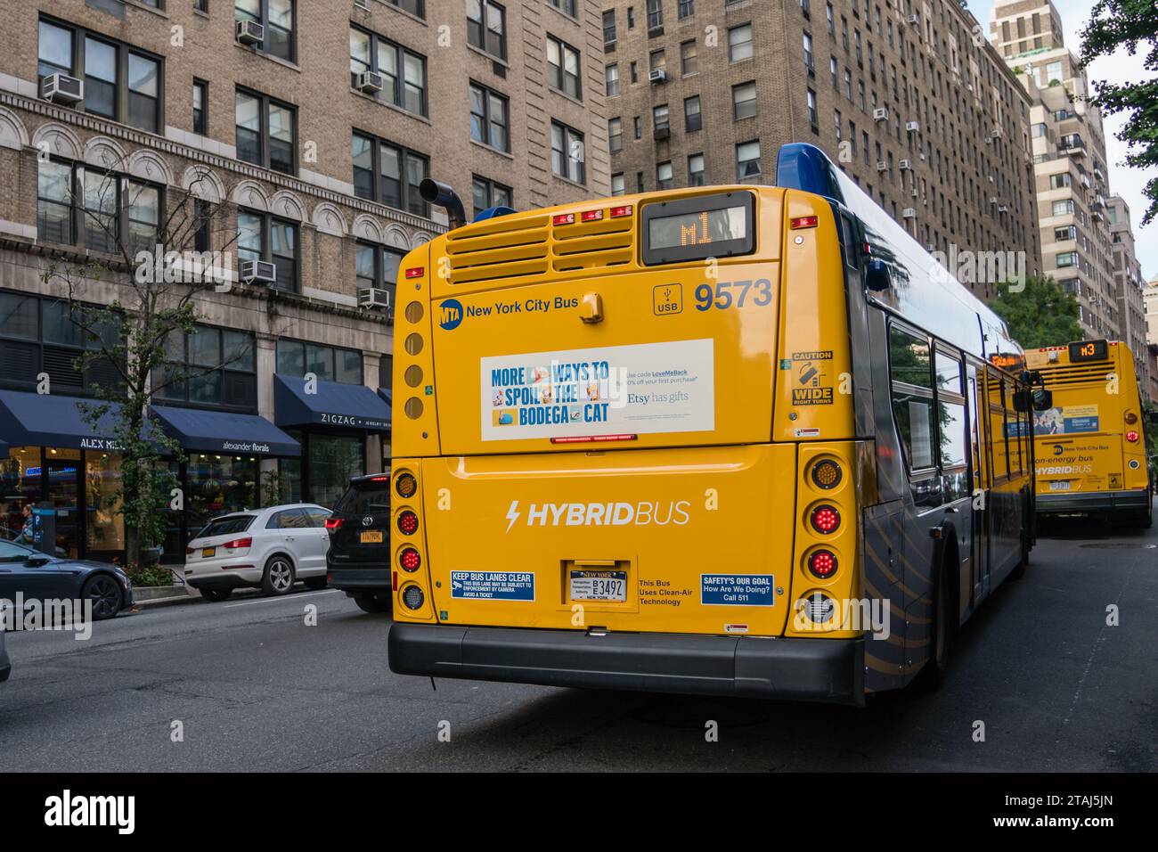 New York, NY, US-September 9, 2023: Yellow hybrid city bus on Manhattan ...