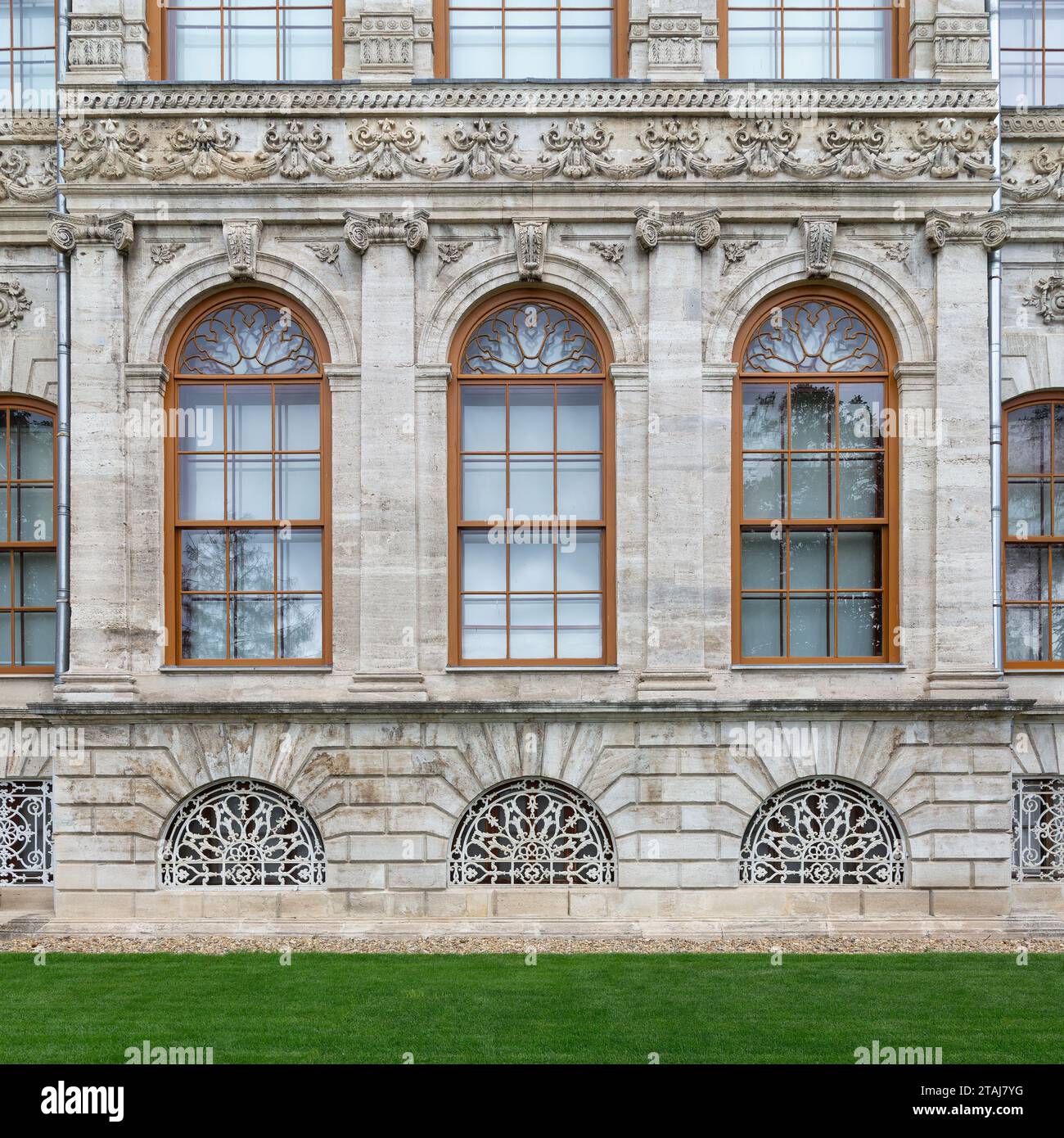 Side wall at Dolmabahce Palace, with three arched sash windows. Palace ...