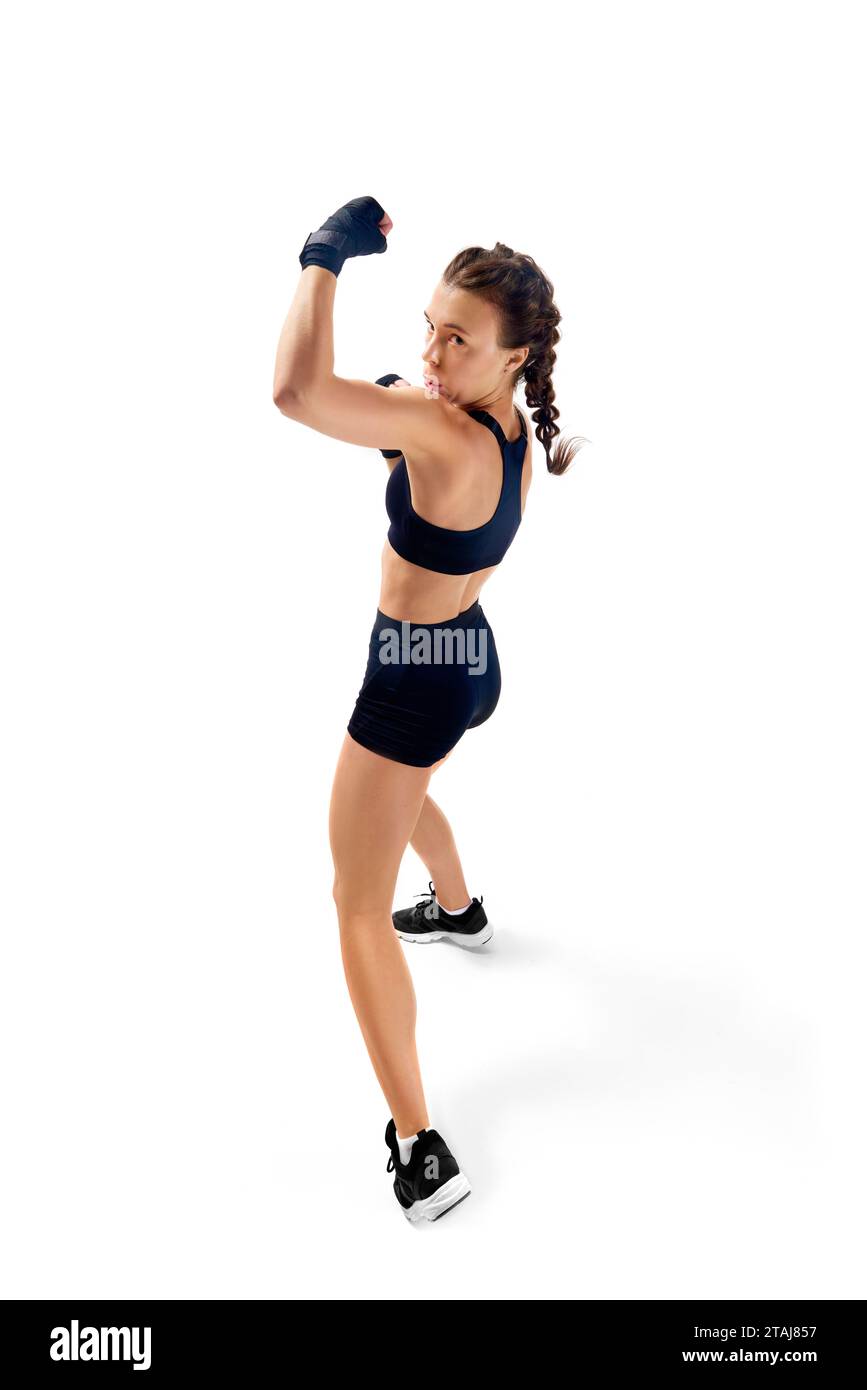 Dynamic portrait of fierce and confident, determined boxer girl ...