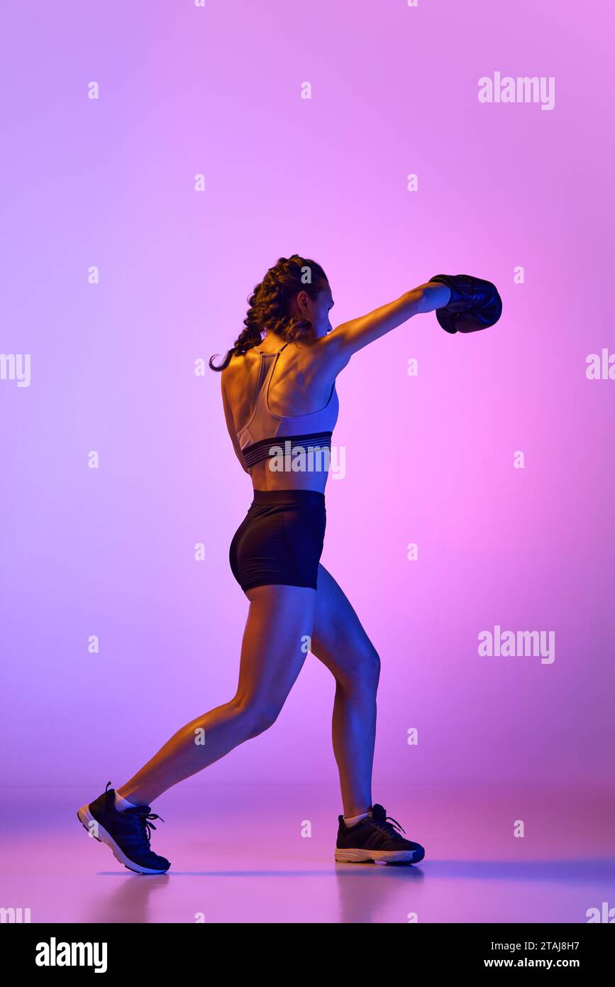 Striking image of female, professional sportsman, boxer showcasing her ...