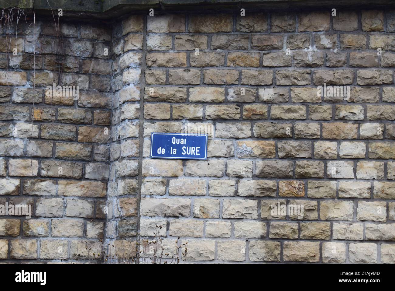 street name sign at old stone walls Stock Photo - Alamy