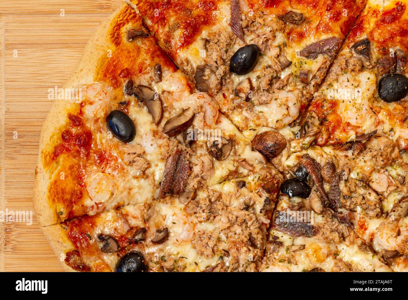 Seafood Pizza section Stock Photo - Alamy