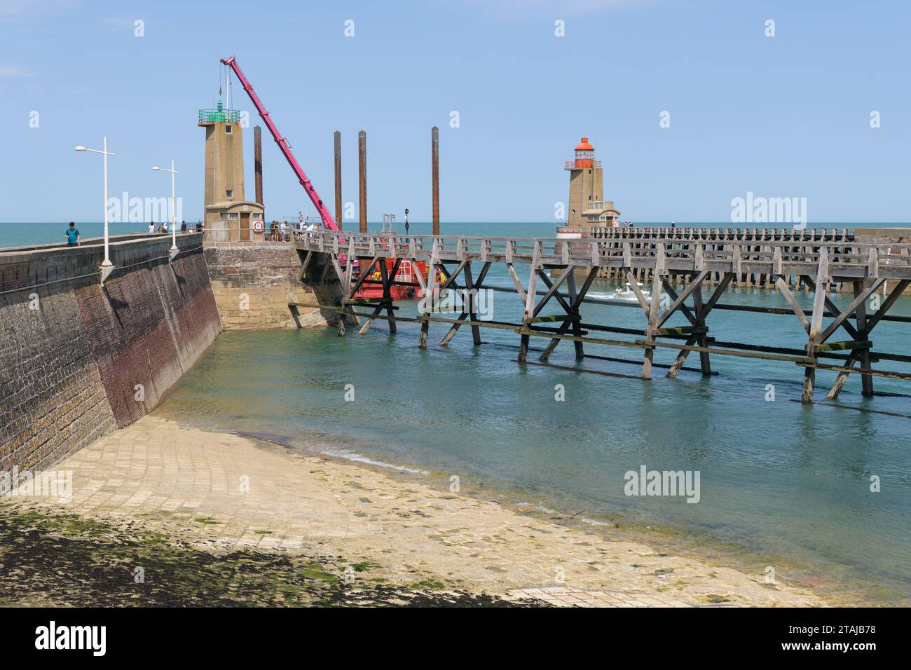 Fecamp, France - July 17, 2022: The entrance of the harbor of Fecamp on ...