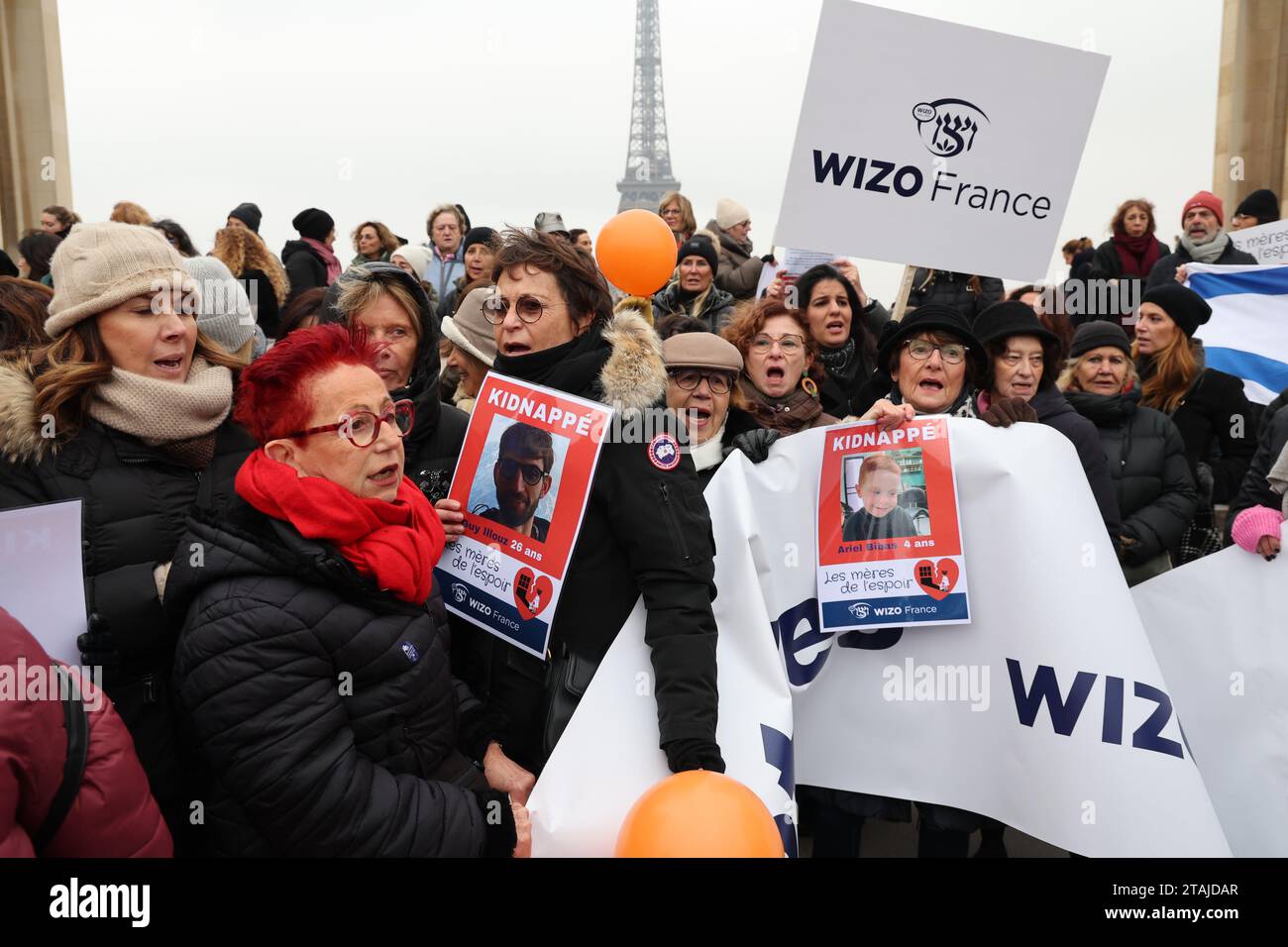 Paris, France. 01st Dec, 2023. French residents hold placards with ...
