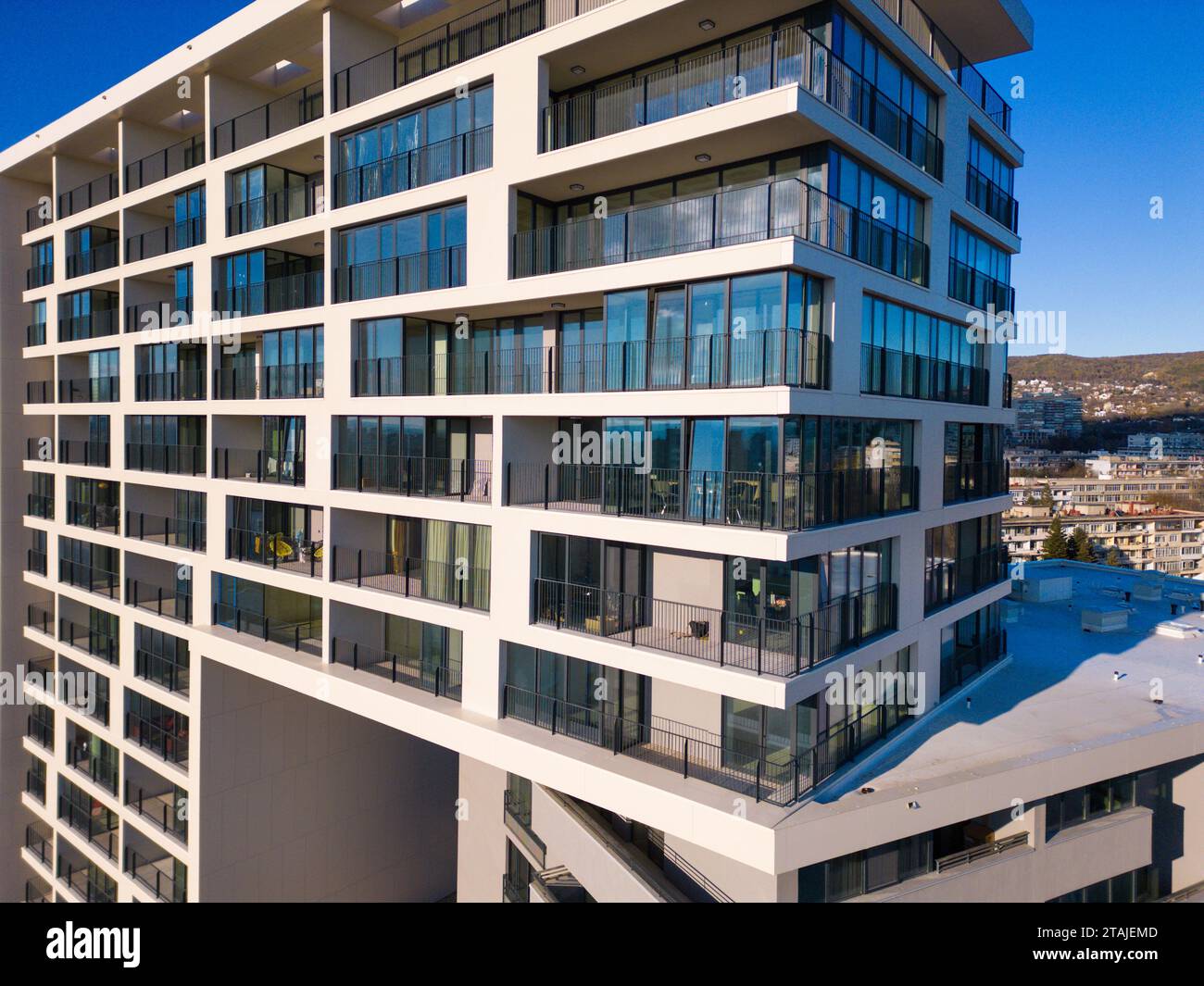 Drone flight along the facade of a modern office or residential ...