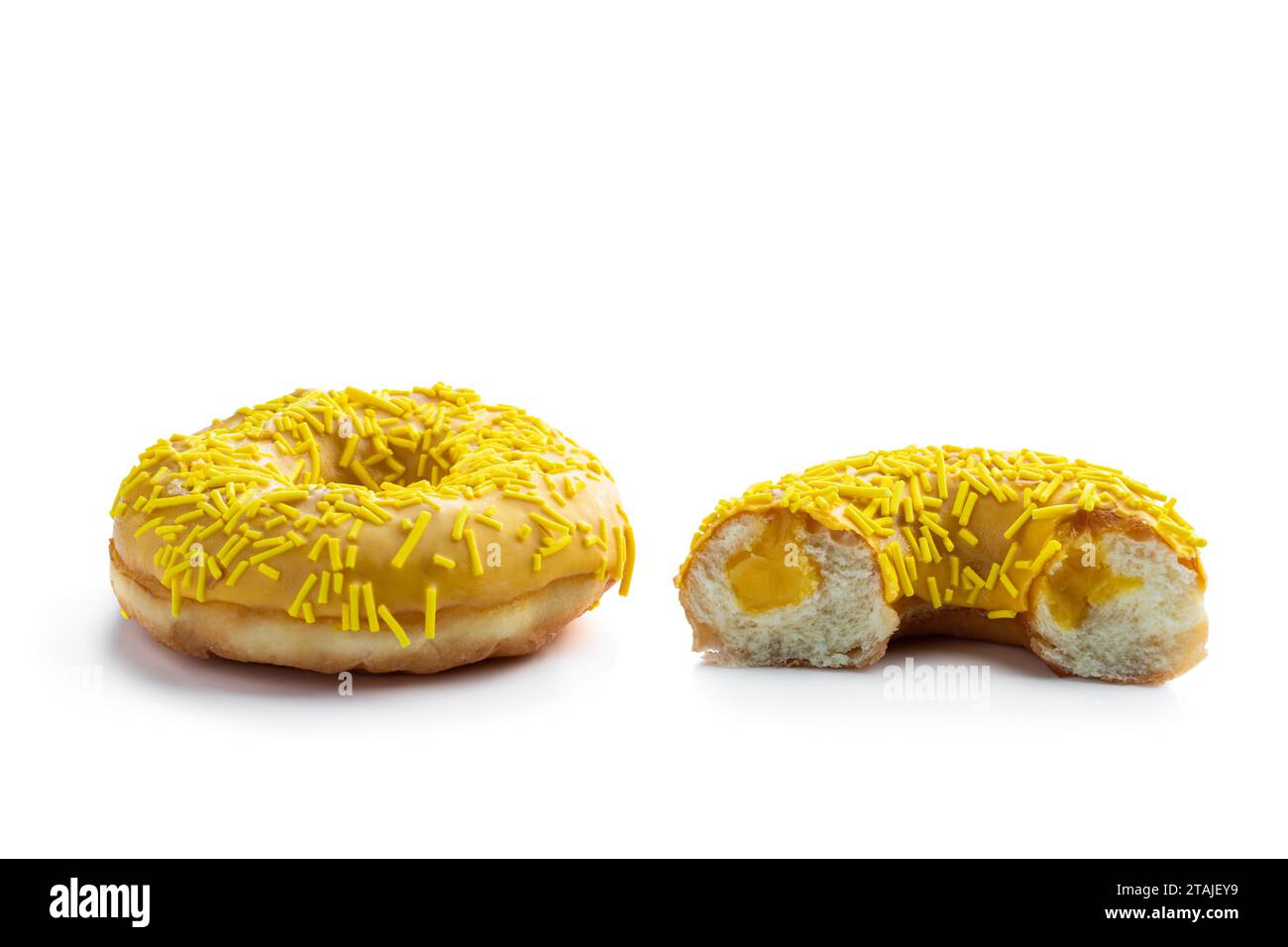 Yellow glazed doughnuts in gray tray isolated on white Stock Photo - Alamy