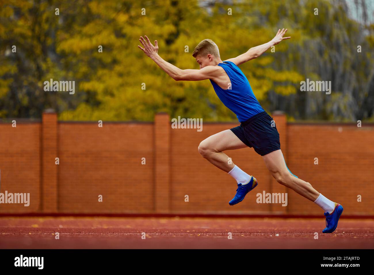 Energetic motion before an explosive jump. Side view full length ...