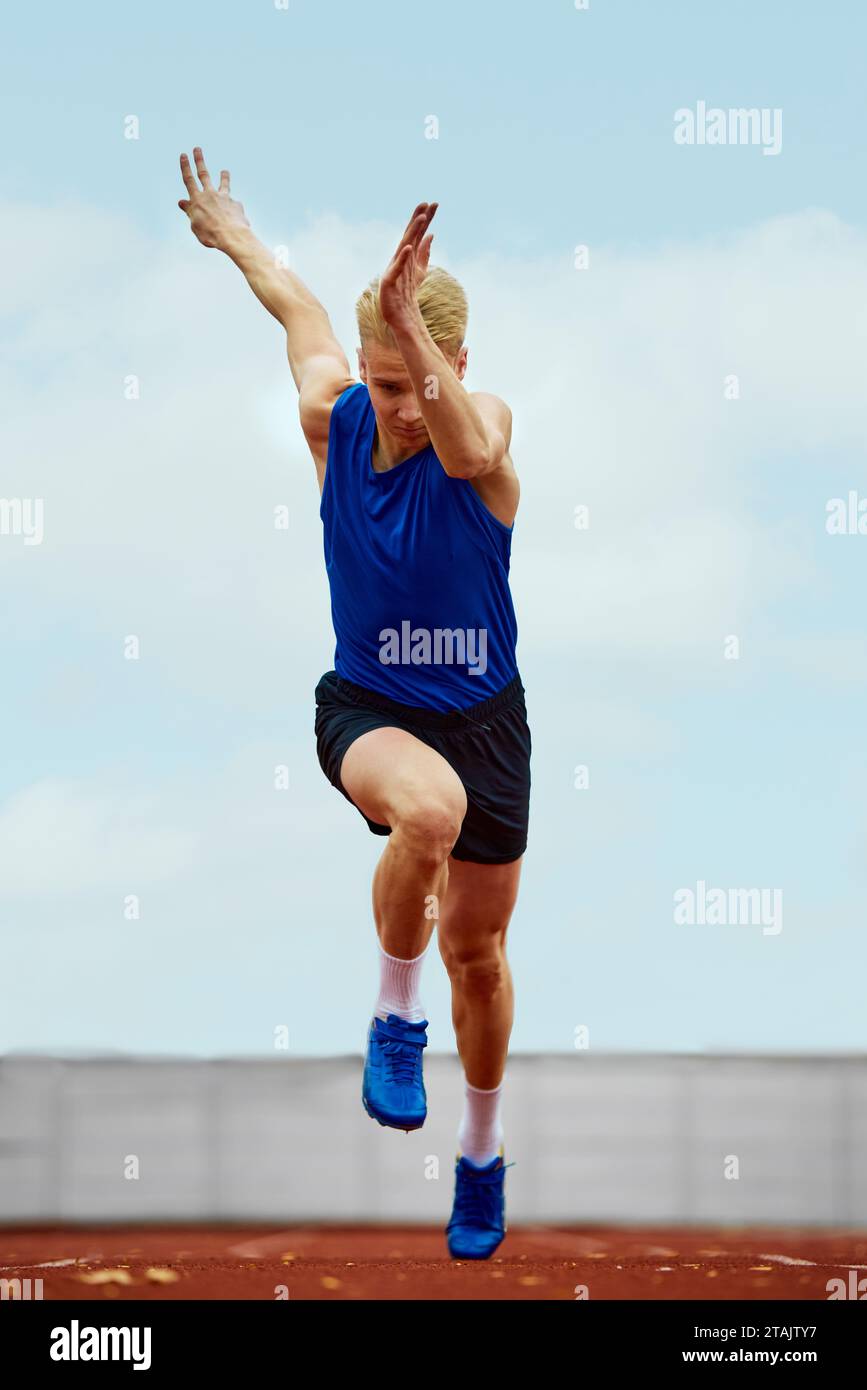 Athlete in full motion, a study of speed. Full length portrait of man ...
