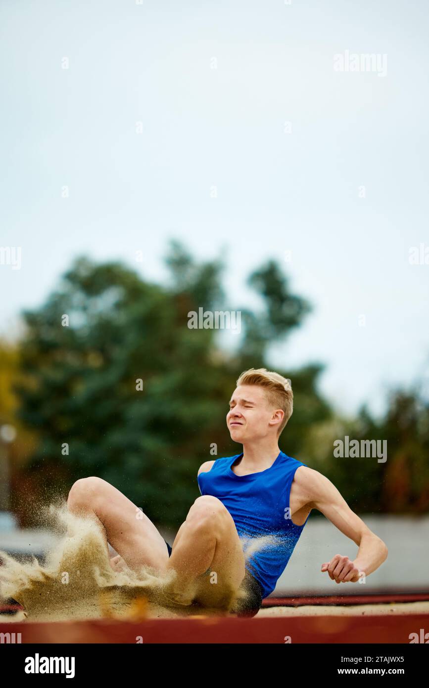 Explosive energy of long jump beautifully frozen in time. Professional ...
