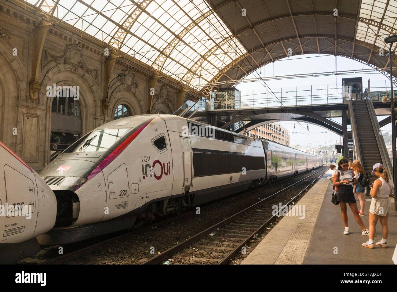 Platform with TGV train & waiting passenger / passengers at Nice-Ville ...