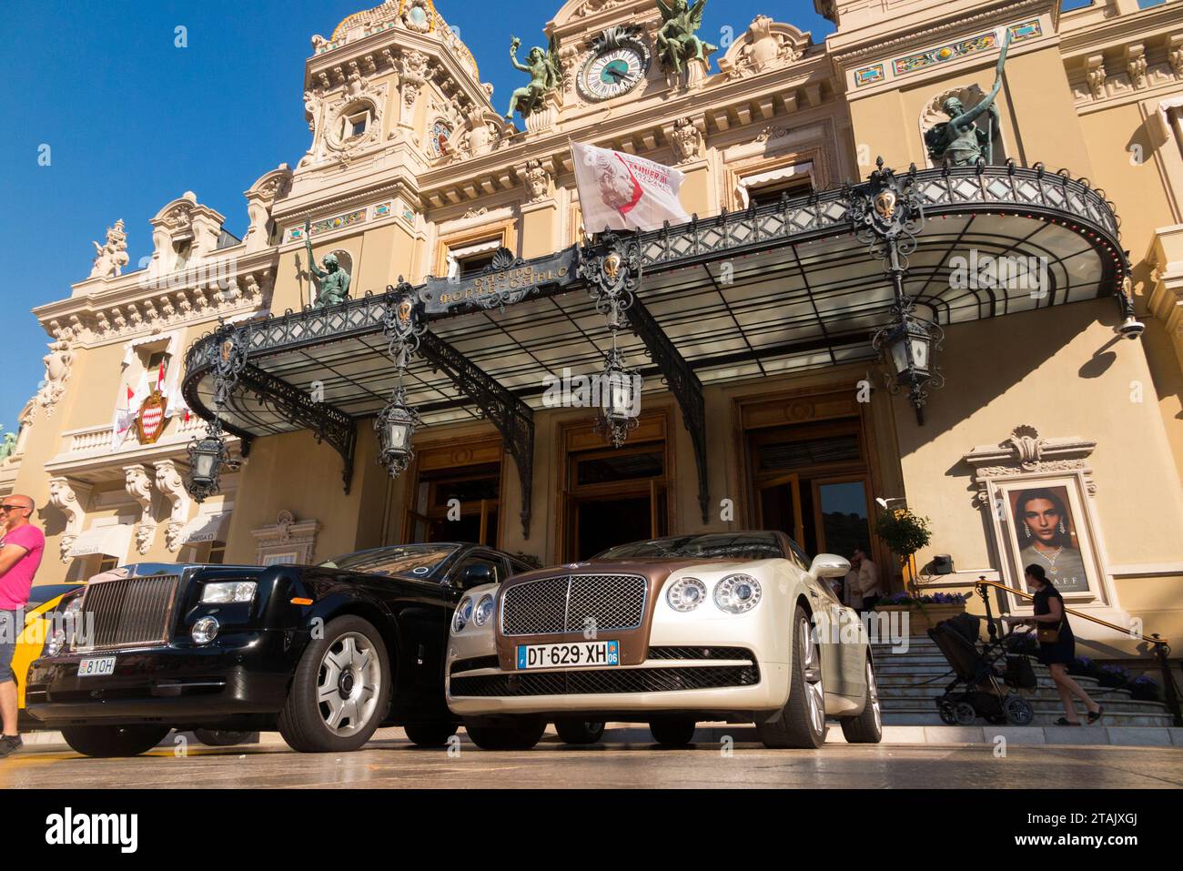Expensive cars, people viewing them and the exterior of Monte Carlo ...
