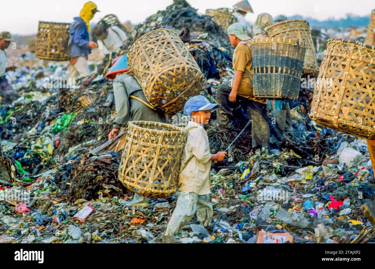 Indonesia, Jakarta. Boy picking garbage at Bantar Gebang, the garbage ...
