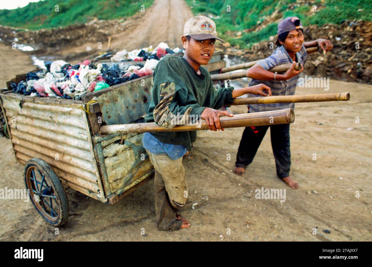 Indonesia, Jakarta. Boys collecting garbage at Bantar Gebang, the ...