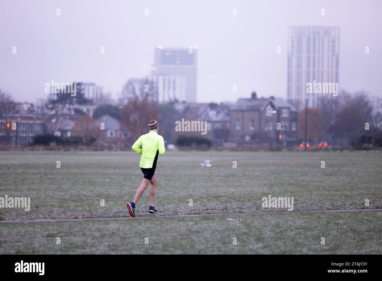 London, UK. 1st Dec, 2023. A man seen running in the freezing early ...