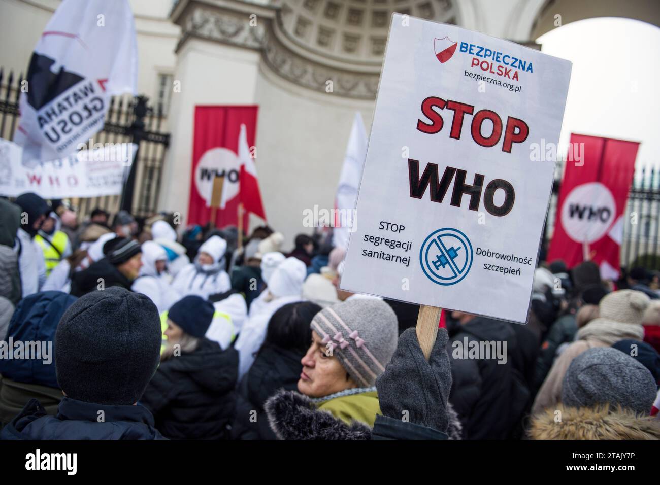 Protesters hold placards with anti-WHO slogans during the demonstration ...